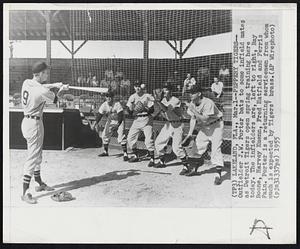 Peppery Tigers-- Outfielder J.W. Porter bats to some infield mates as ...