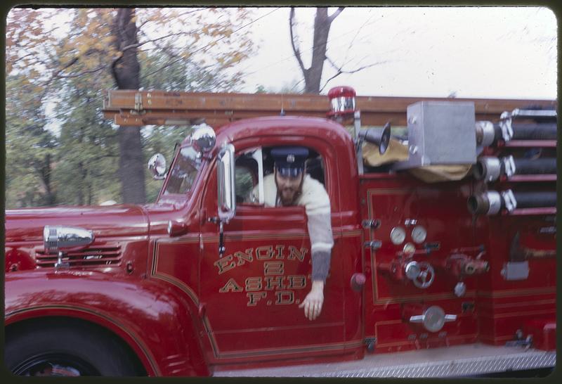 A fireman leaning out of the window of the Engine 2, Ashby Fire ...