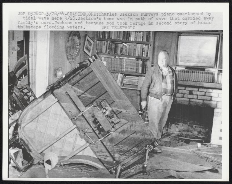 Charles Jackson surveys piano overturned by tidal wave here 3/28 ...