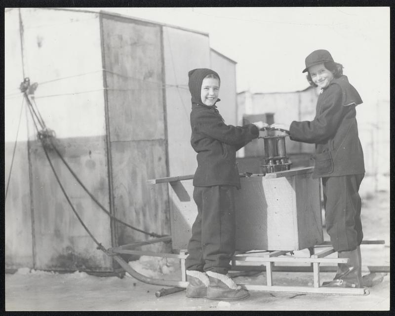Warming their hands during outdoor fishing are Betsy Cook and Sandra ...