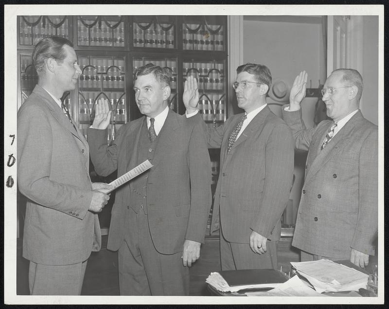 New State Officials-Gov. Tobin, left, swears in three public officials ...