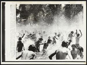 Splish Splash-- Youths attending the antiwar demonstration at the ...
