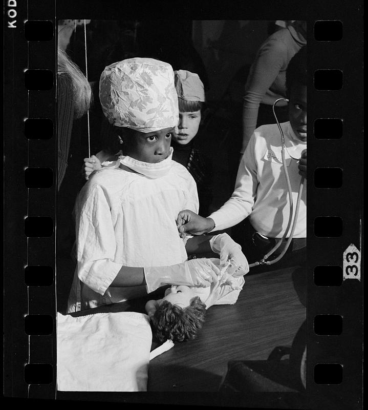 Young patients play with medical paraphernalia at "preinduction party ...