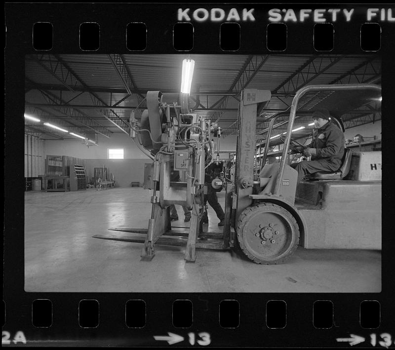 Forklift carrying machinery - Digital Commonwealth