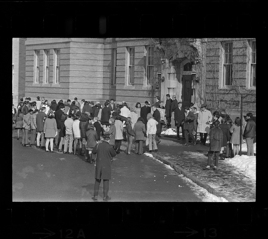 Students watch their teachers march the picket line outside of Woburn ...