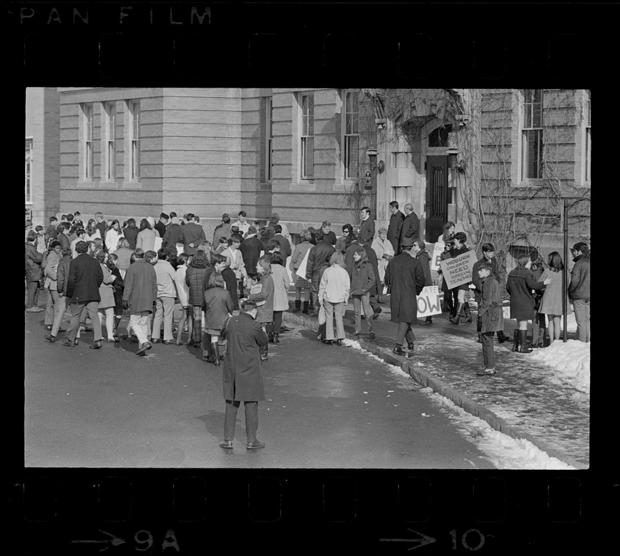 Students watch their teachers march the picket line outside of Woburn ...