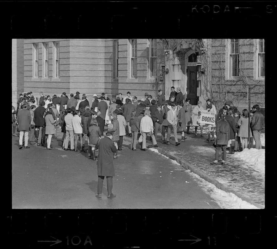 Students watch their teachers march the picket line outside of Woburn ...