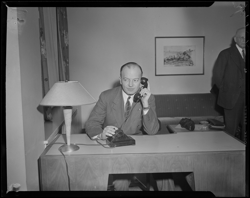 Former Minnesota Governor Harold Stassen at desk, on telephone ...