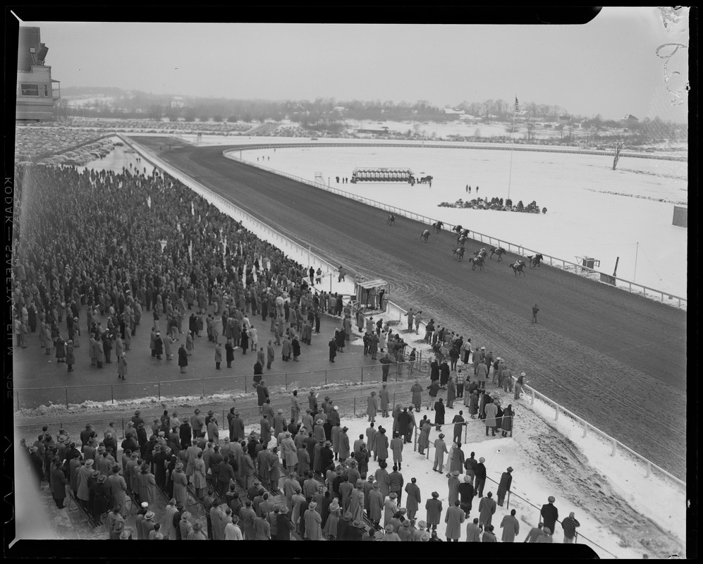 Spectators watching horse race at opening of Lincoln Downs, Rhode ...