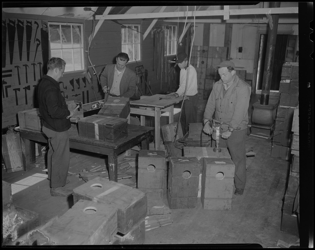 Four men building boxes in a workshop - Digital Commonwealth