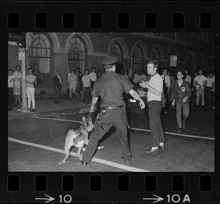 Police with dogs patrolling area around Boston Common during curfew ...