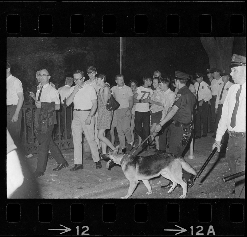 Police with dogs patrolling area around Boston Common during curfew ...