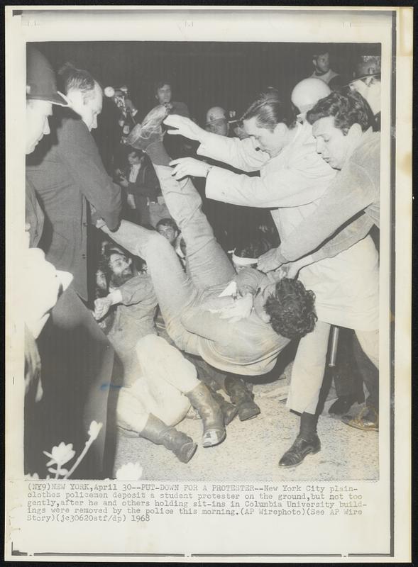 Put-Down for a Protestor--New York City plain-clothes policemen deposit ...