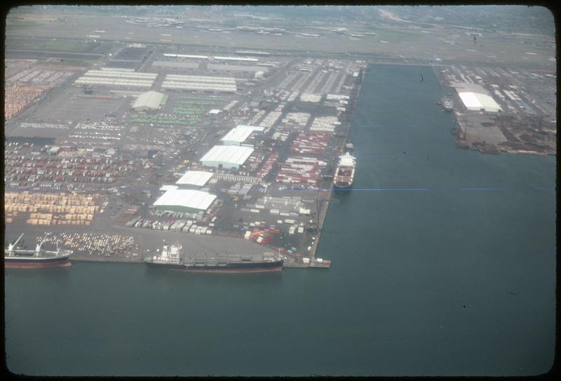 Aerial view of docked ships by freight terminal - Digital Commonwealth