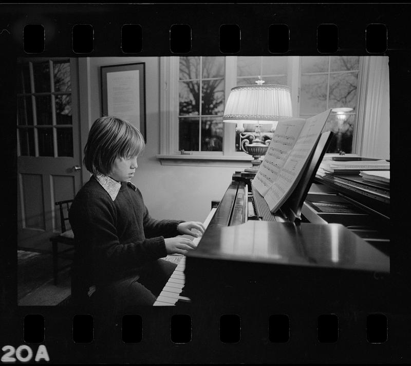 Bruce Irving's child playing the piano - Digital Commonwealth