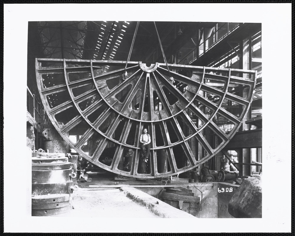 Man on half wheel - Digital Commonwealth