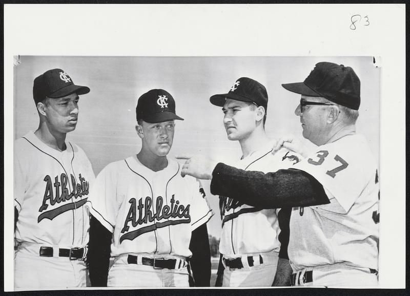 Camp Talk-Manager Ed Lopat, right, of Kansas City A’s, talks with ...