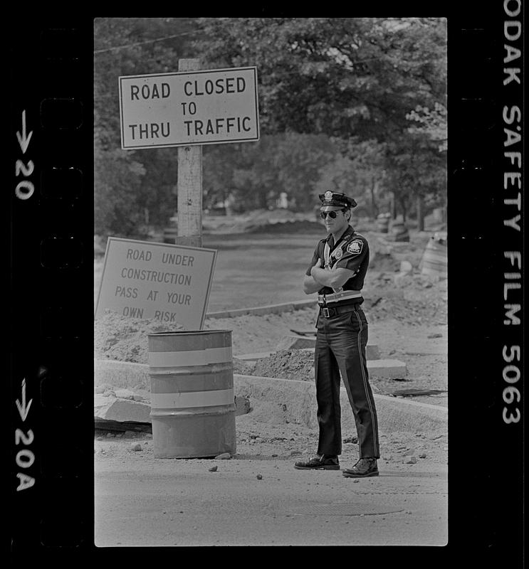 Police officer supervising road work - Digital Commonwealth