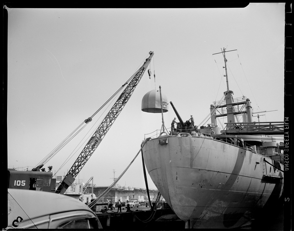 Crane lifts turret onto USS Libra - Digital Commonwealth