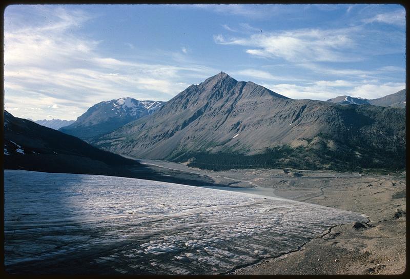 Snow and ice on level ground at foot of mountain, British Columbia ...