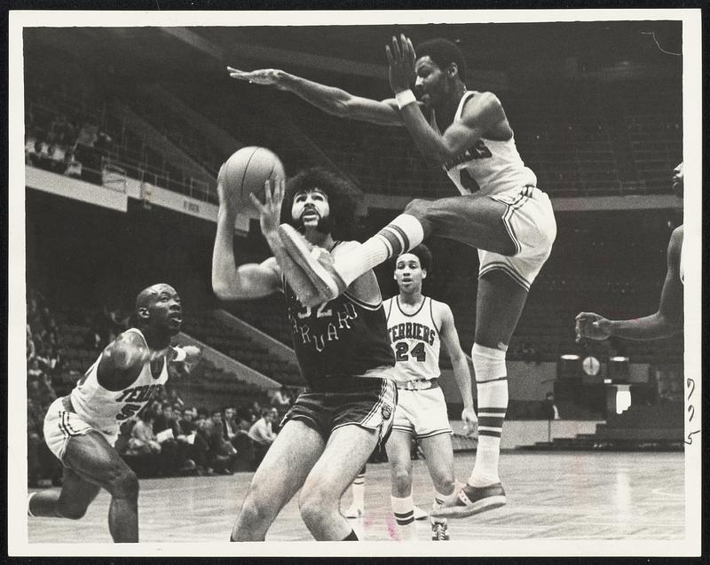 Not This Time-James Garvin (4) of Boston University jumps to prevent ...