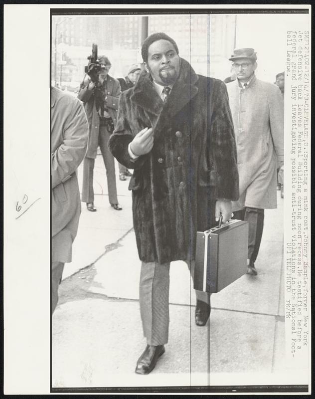 Sporting a mink coat, Johnny Sample, former New York Jet defensive back ...