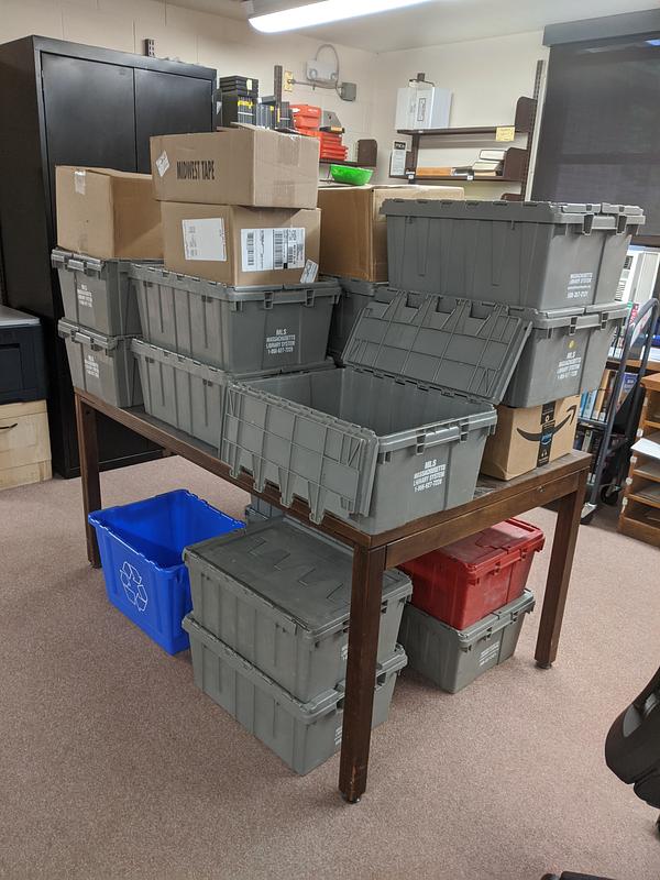 Room of storage totes - Digital Commonwealth