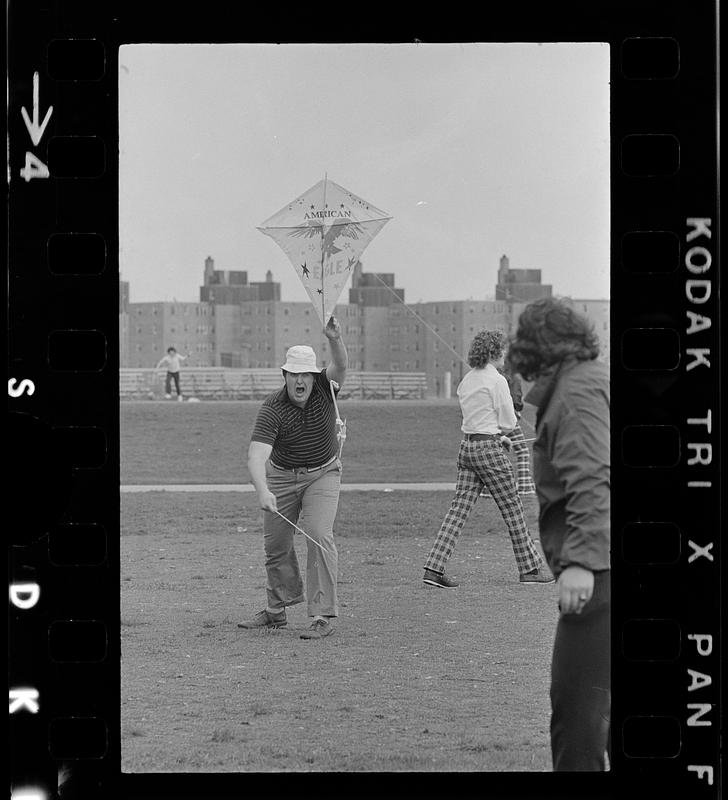 Launching a kite at Columbia Point, Boston - Digital Commonwealth