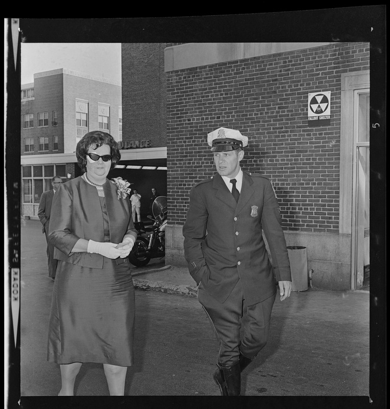 School Committee Chairman Louise Day Hicks guarded by Boston Police as ...