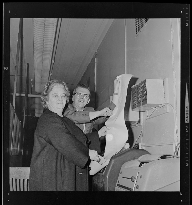 Unidentified woman and man at teletype machine - Digital Commonwealth
