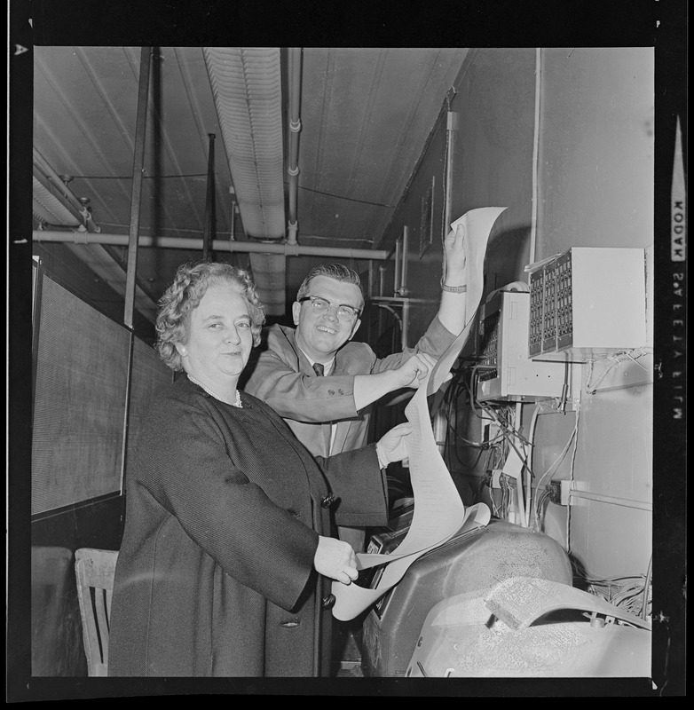 Unidentified woman and man at teletype machine - Digital Commonwealth