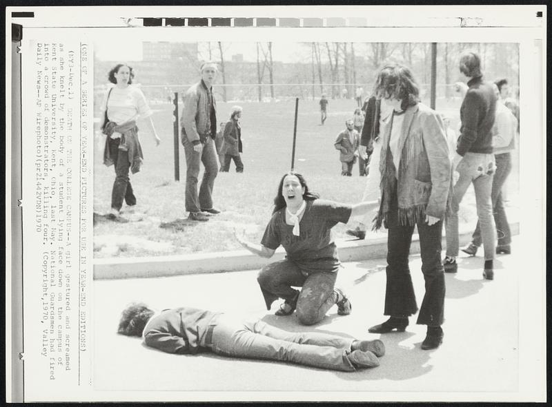 Death On the College Campus--A girl gestured and screamed as she knelt ...