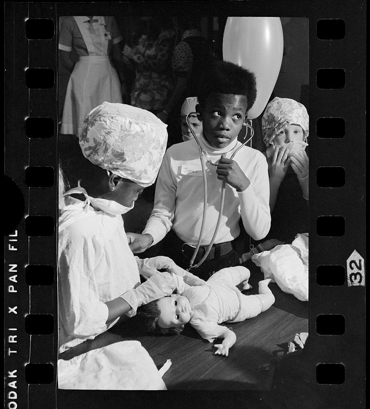 Young patients play with medical paraphernalia at "preinduction party ...