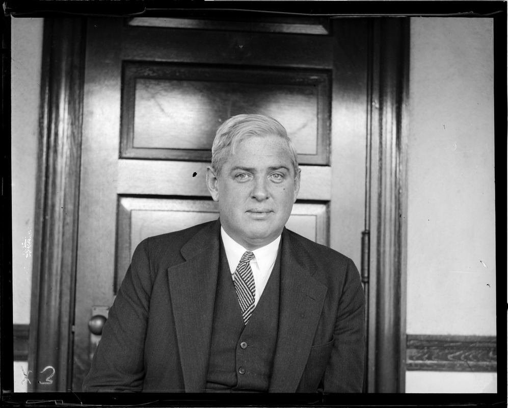 Unidentified man in car - Digital Commonwealth