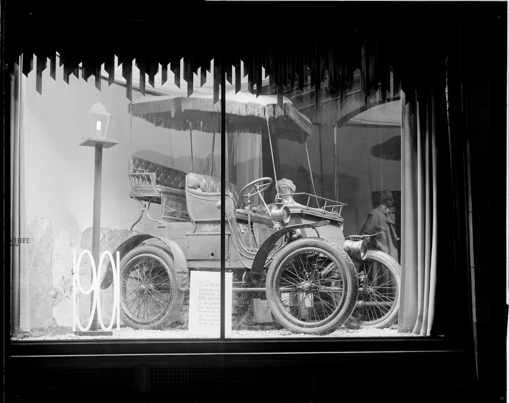 First Packard car, 1901, in window at White's - Digital Commonwealth