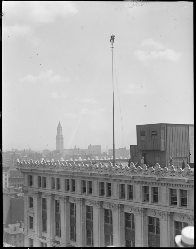 Steeplejack or "flagpole sitter" on a flagpole - Digital Commonwealth