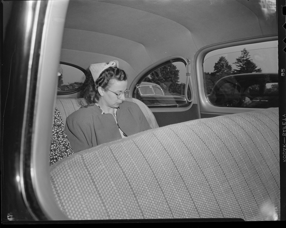 Woman avoiding the camera on trip to court - Digital Commonwealth