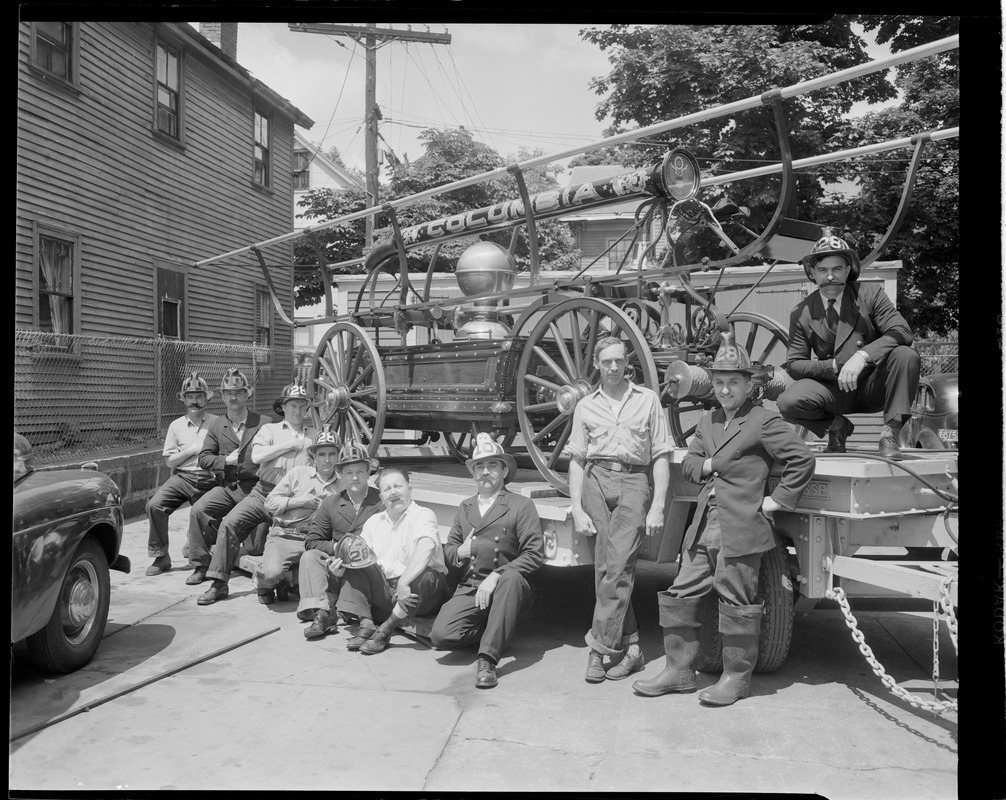 Firemen pose with old fire engine Columbia - Digital Commonwealth