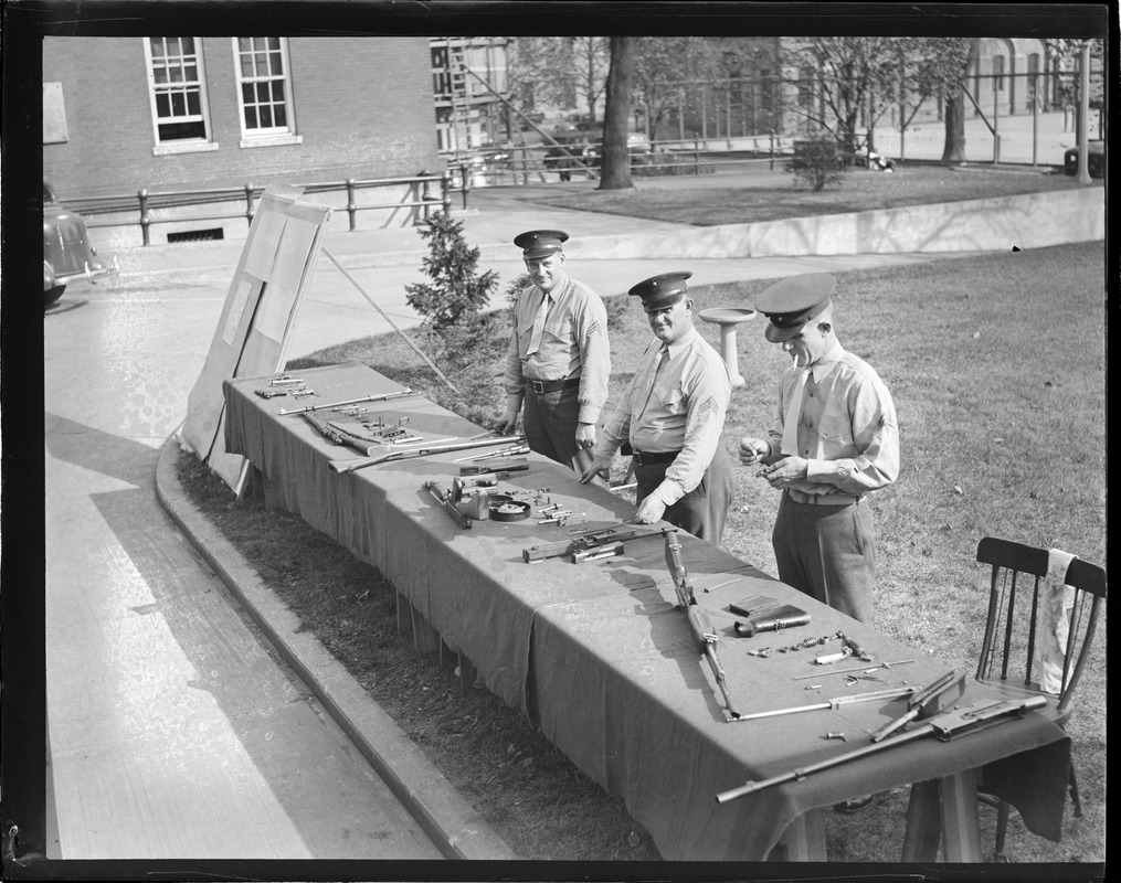 Marines taking machine gun apart in Navy Yard. - Digital Commonwealth