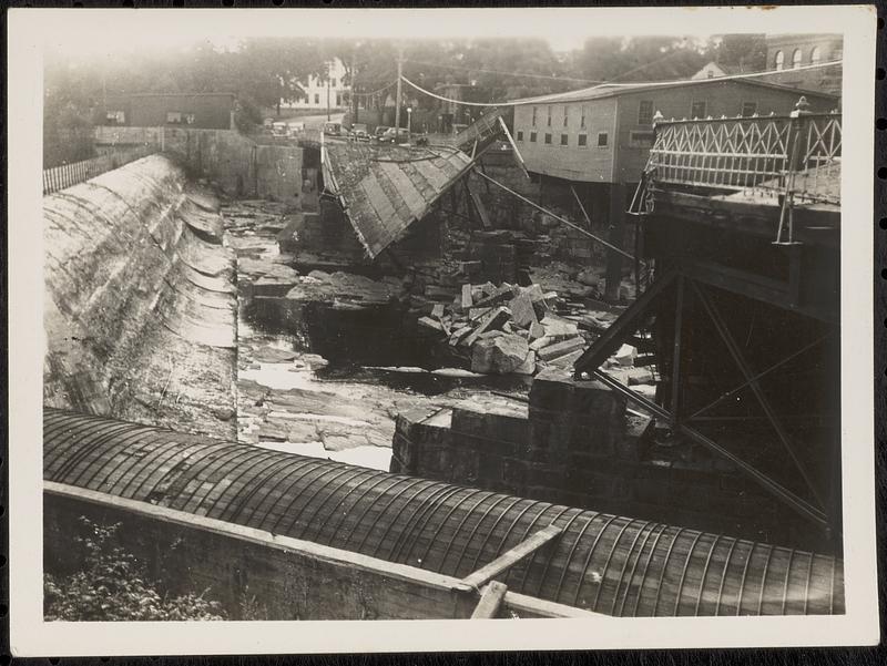 Remains of Main St. bridge, with dam and penstock, after flood waters ...