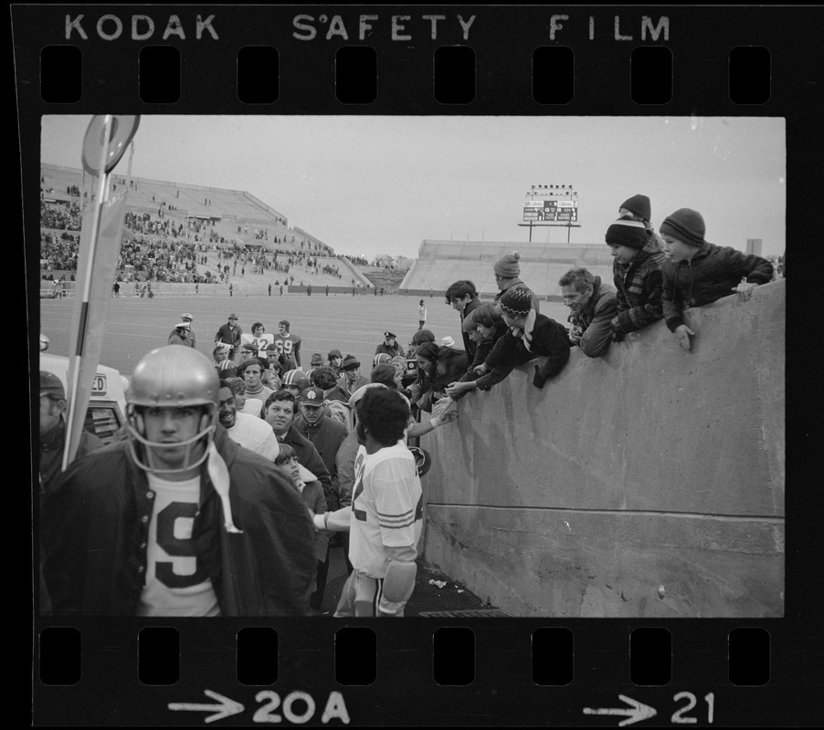 Spectators greeting Boston College players as they pass into stadium ...