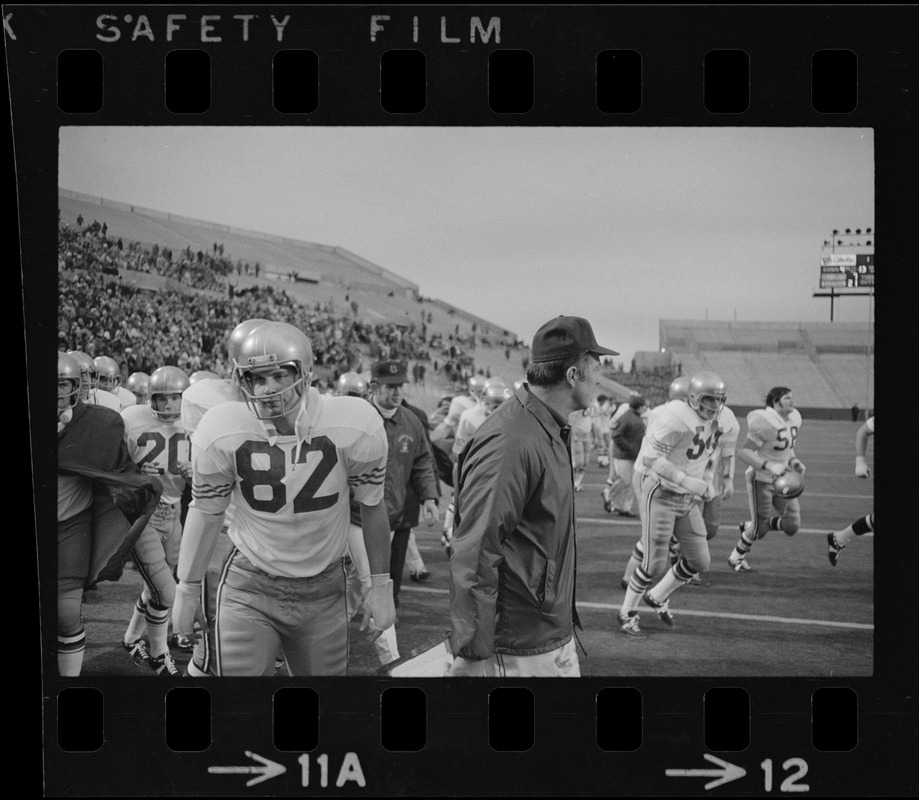Boston College football coach Joe Yukica (center) and players seen on ...