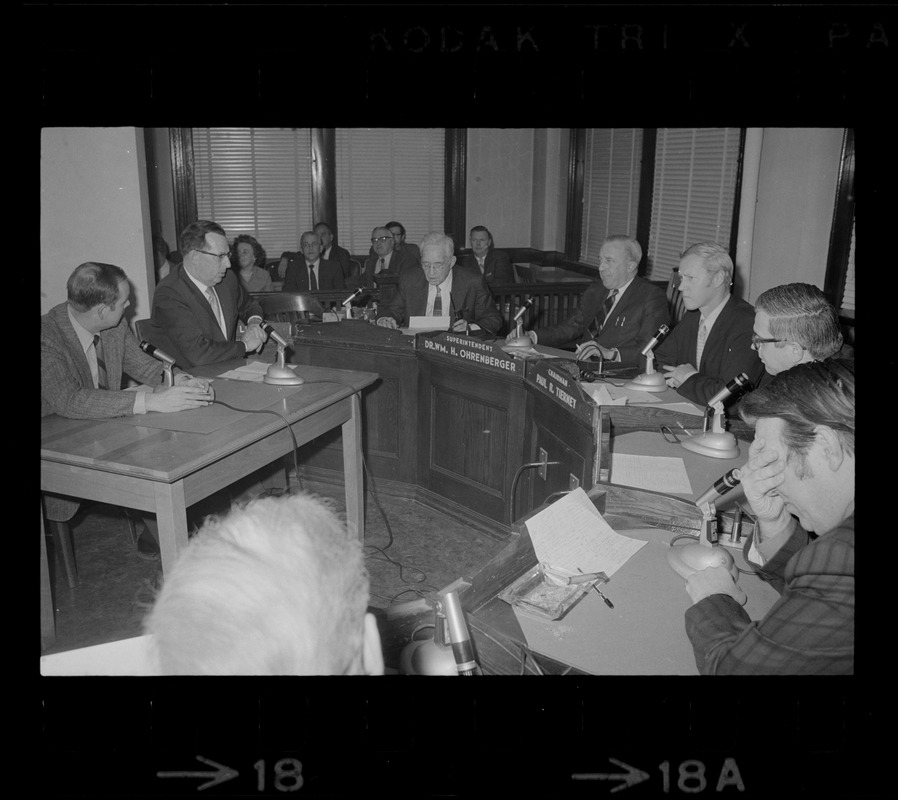 James W. Dailey, left, headmaster of English High School, appears ...