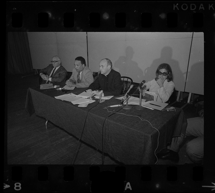 Panel sitting at table speaking during Tufts University student protest ...