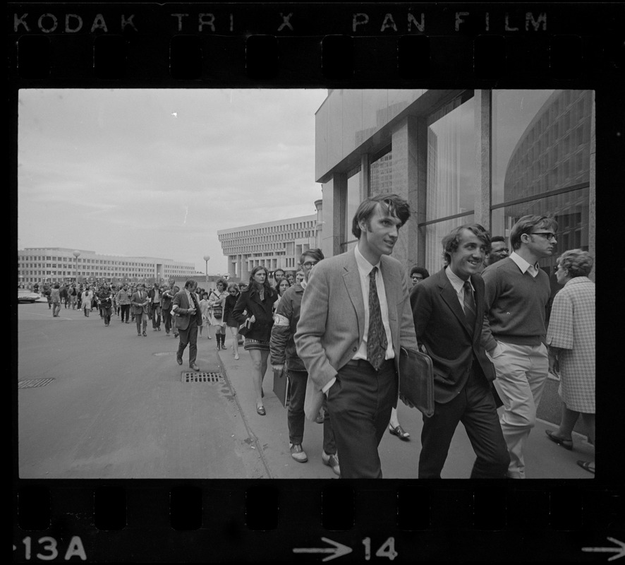 Protesters marching from a peace rally at Boston City Hall Plaza ...