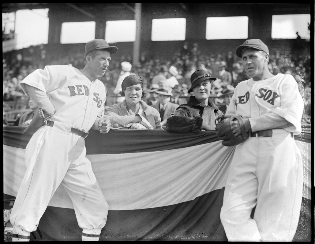 Red Sox players, including Lefty Grove, pose in front of stands with ...