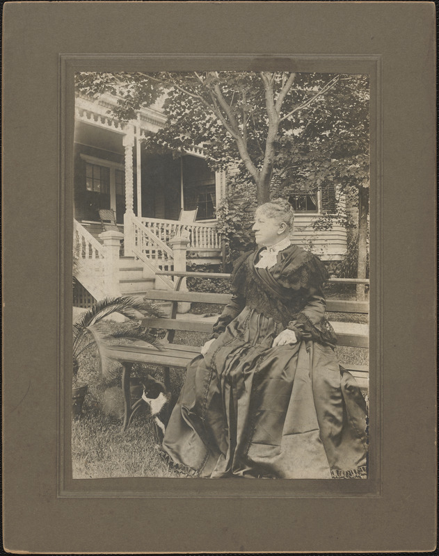 Mrs. Warren G. (Cynthia) Roby sitting on the lawn in front of her home ...