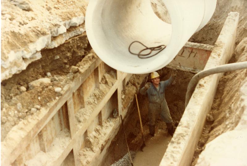 Construction worker laying pipe at 5 Cambridge Center - Digital ...
