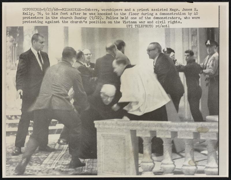 Ushers, worshipers and a priest assisted Msgr. James E. Kelly, 76, to ...