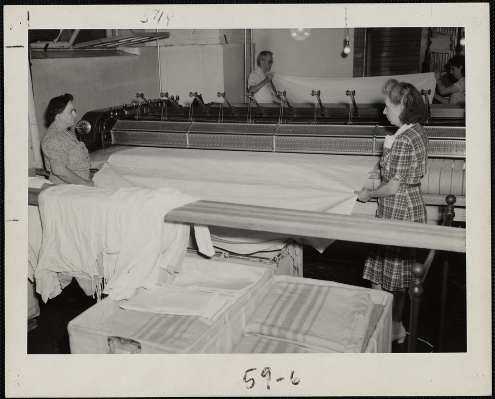 Pressing linens at the Faulkner Hospital laundry - Digital Commonwealth